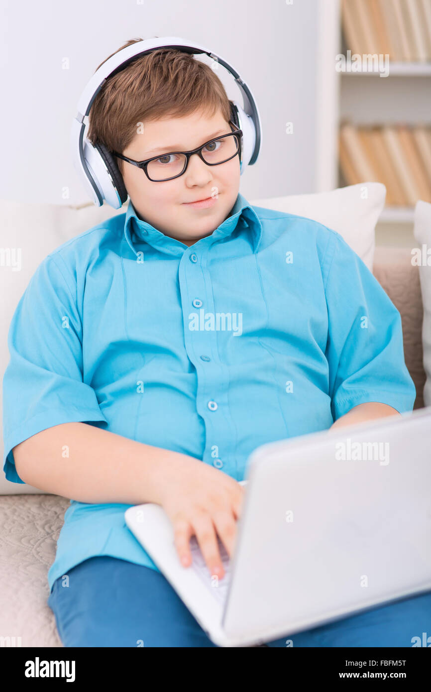 Chubby kid playing games on the laptop Stock Photo - Alamy