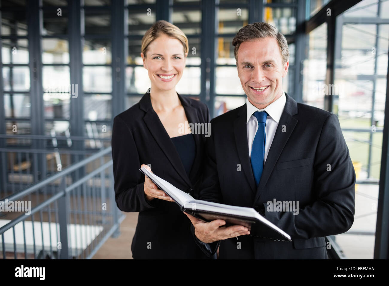 Business people smiling Stock Photo - Alamy