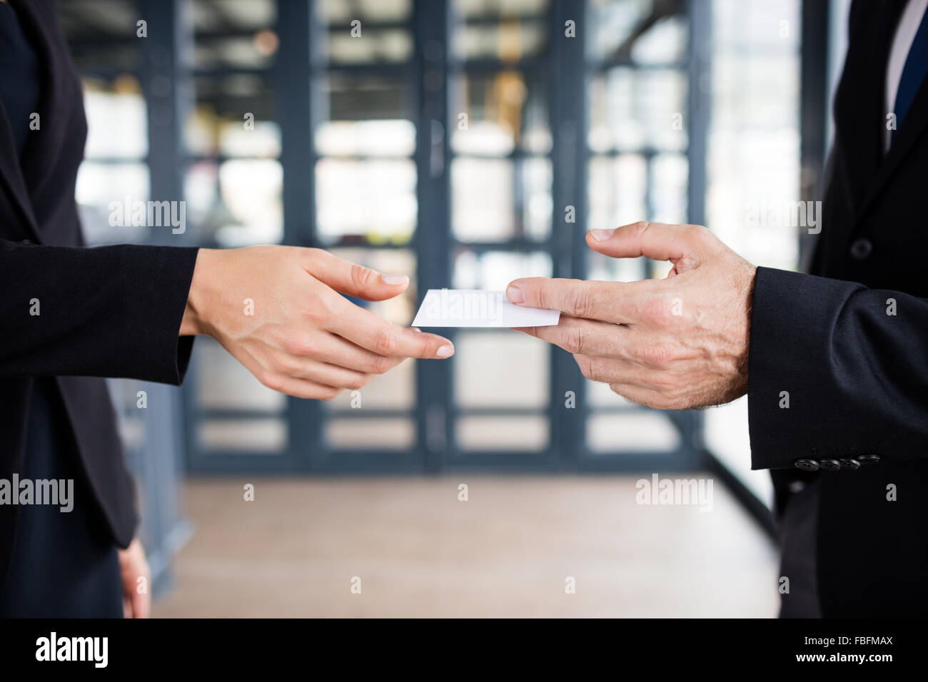 Businessman giving his business card Stock Photo - Alamy