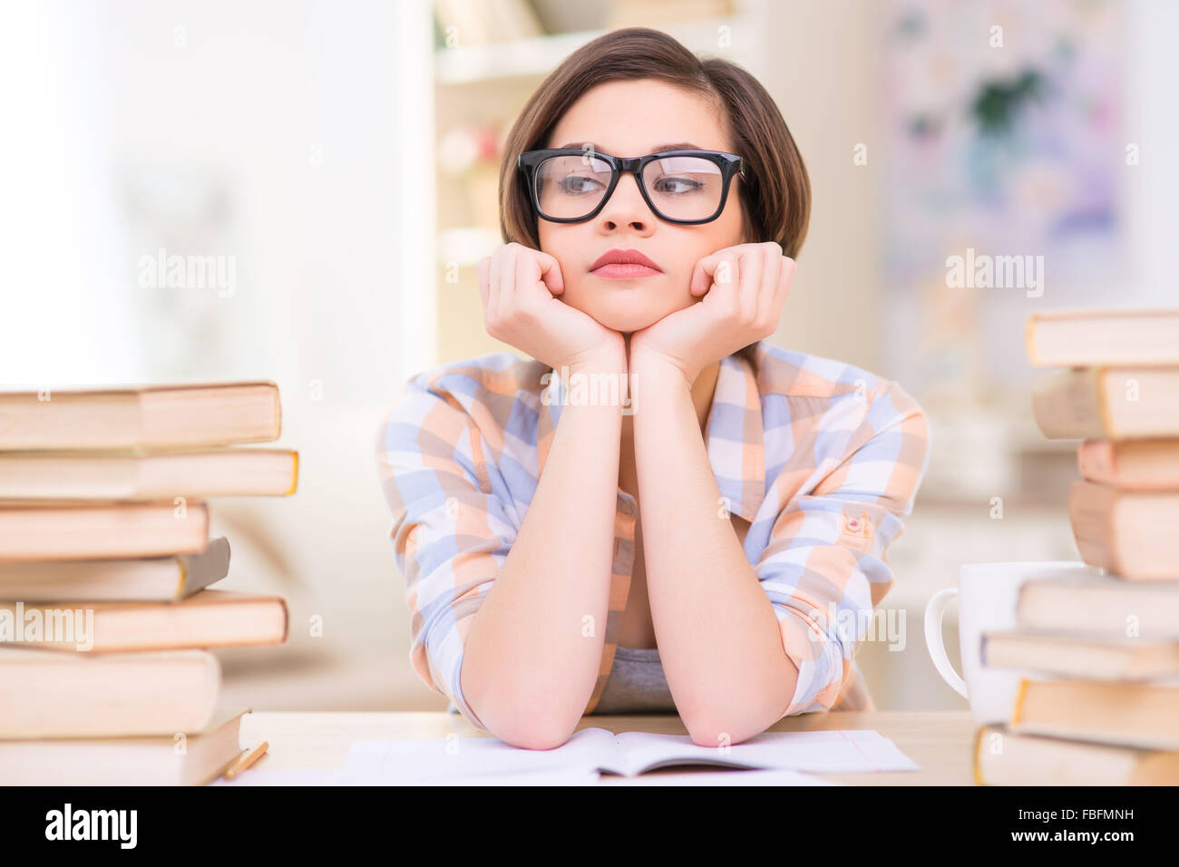 Young girl looking pretty bored Stock Photo - Alamy