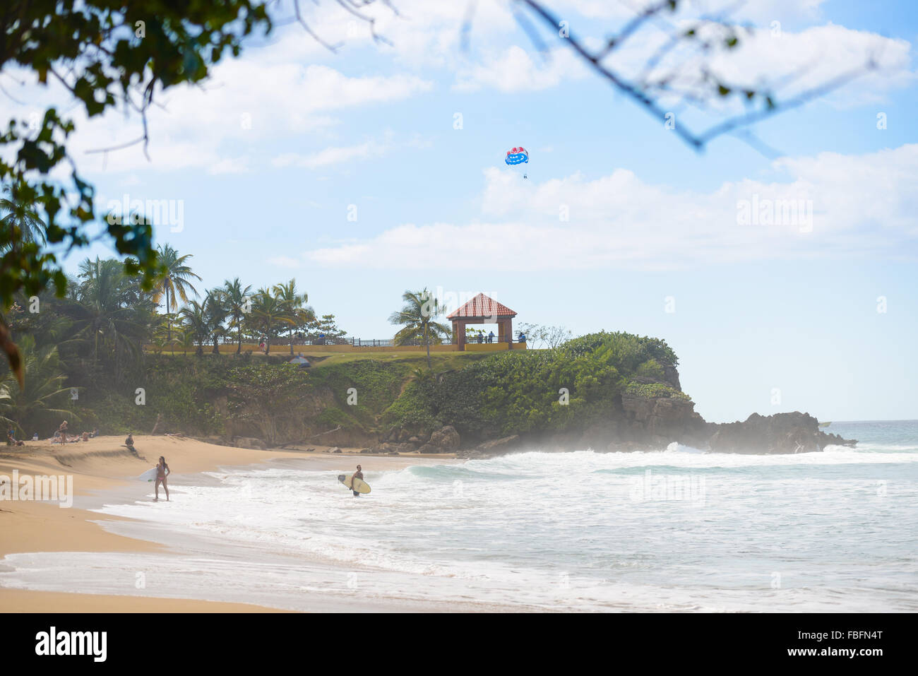 Surfers and parasailing at Dome's Beach. Rincon, Puerto Rico. USA ...