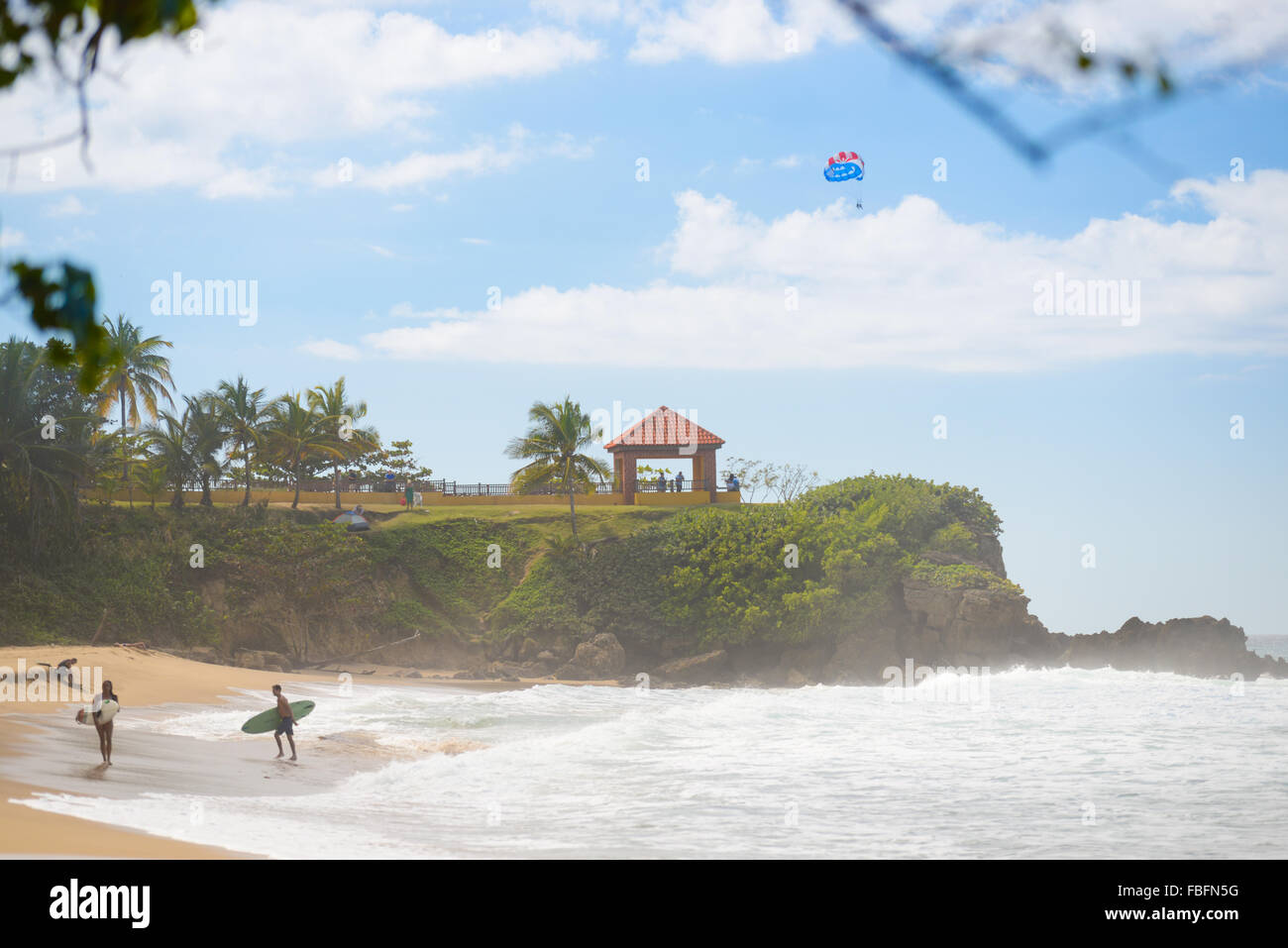 Surfers and parasailing at Dome's Beach. Rincon, Puerto Rico. USA ...