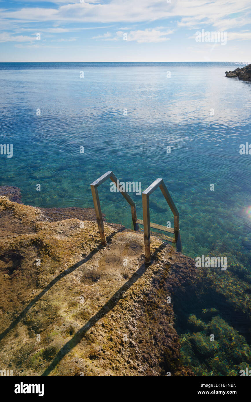 Ladder in a natural seawater pool on a Mediterranean beach resort Stock ...
