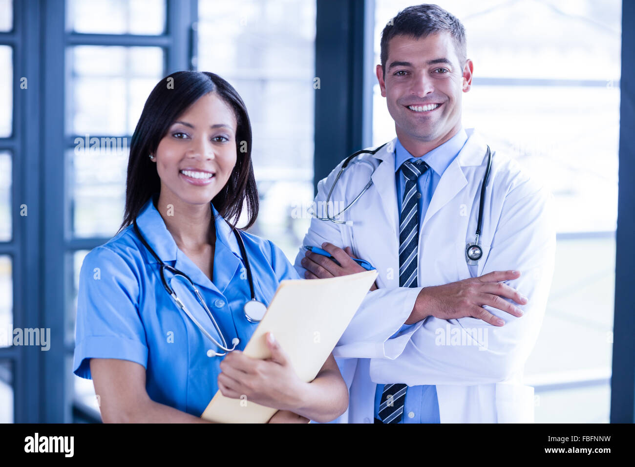 Nurse and doctor smiling Stock Photo - Alamy