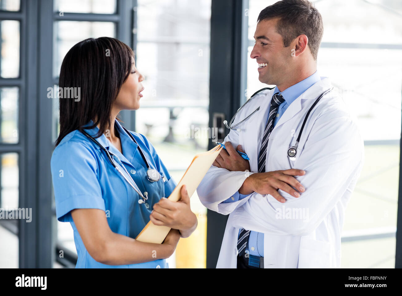 Workers talking other smiling hi-res stock photography and images - Alamy