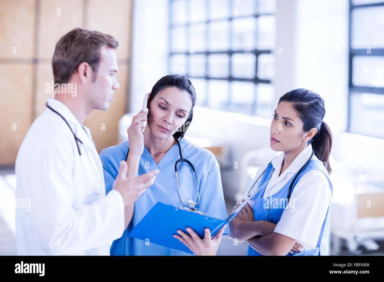 Team discussing documents writing hi-res stock photography and images ...