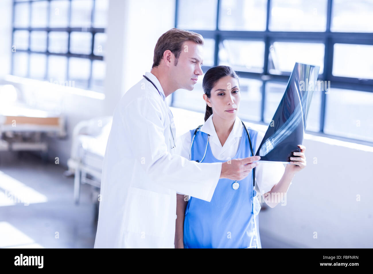 Medical team looking at x-ray together Stock Photo - Alamy