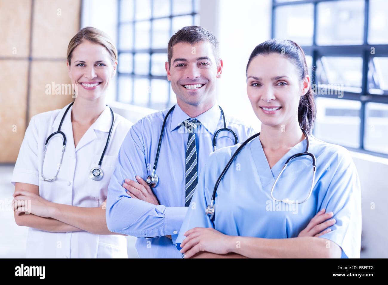 Medical team with arms crossed Stock Photo - Alamy