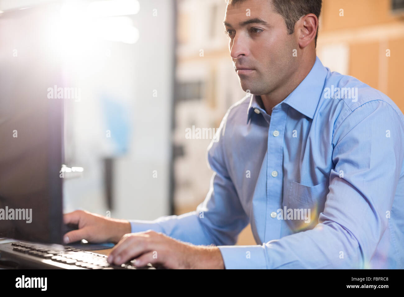 Serious businessman working on computer Stock Photo - Alamy