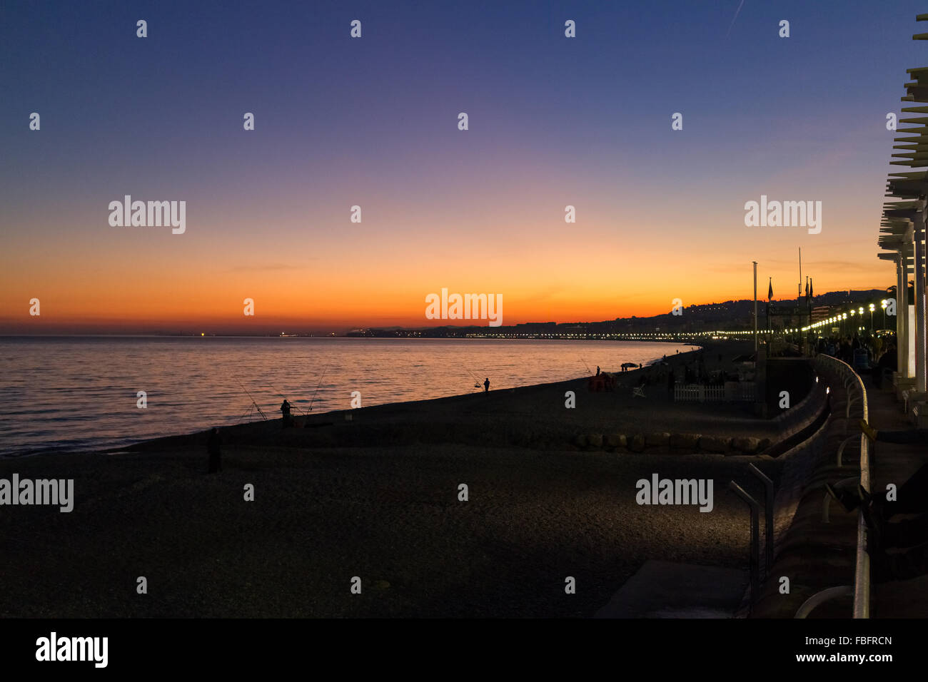Sunset on a Mediterranean beach in the French Riviera with view of ...