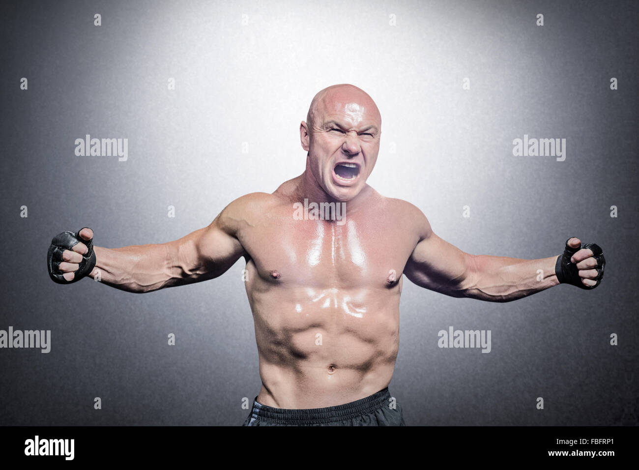 Composite image of aggressive fighter against black background Stock ...