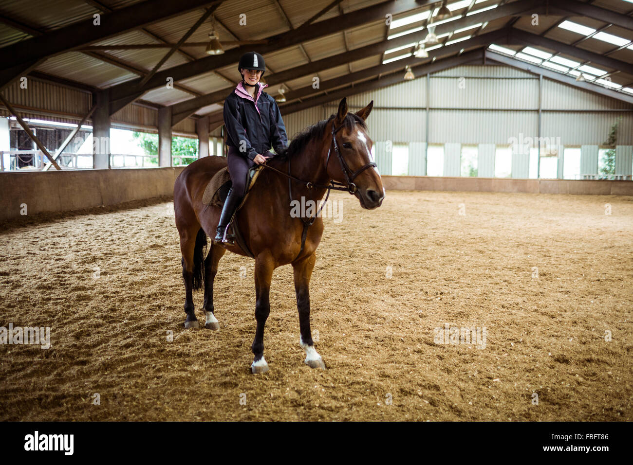 Female rider riding her horse Stock Photo - Alamy
