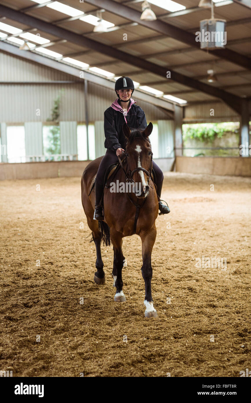 Female rider riding her horse Stock Photo - Alamy