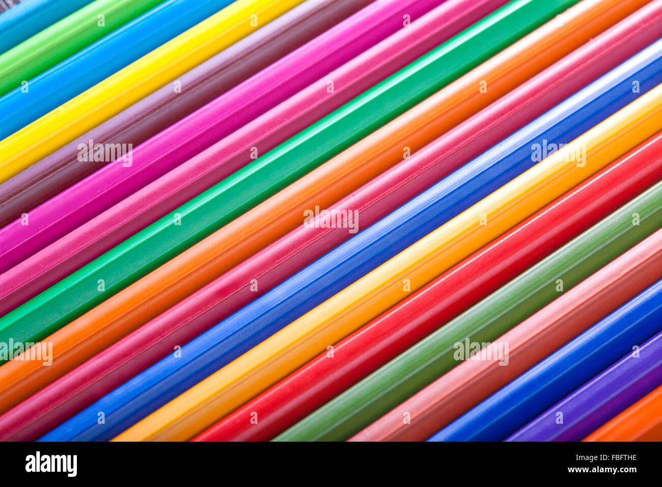 Diagonal row of colorful pencils Stock Photo - Alamy