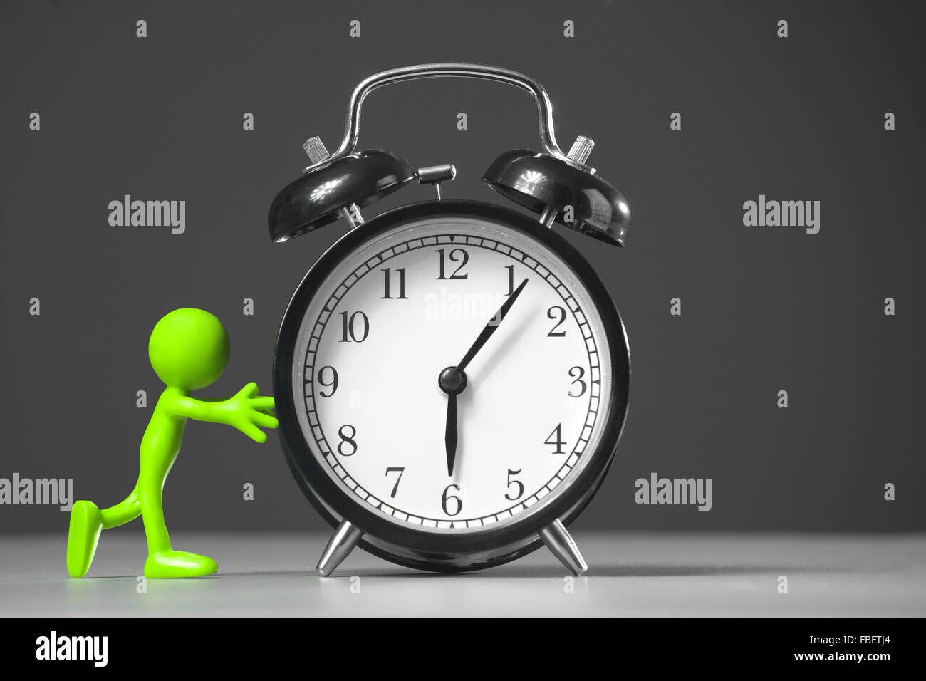 Red man and an alarm clock Stock Photo - Alamy