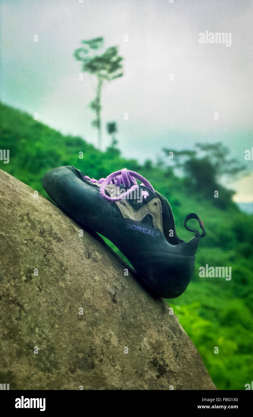 Rock climbing shoe frictioned against rock in tropical scene Stock ...