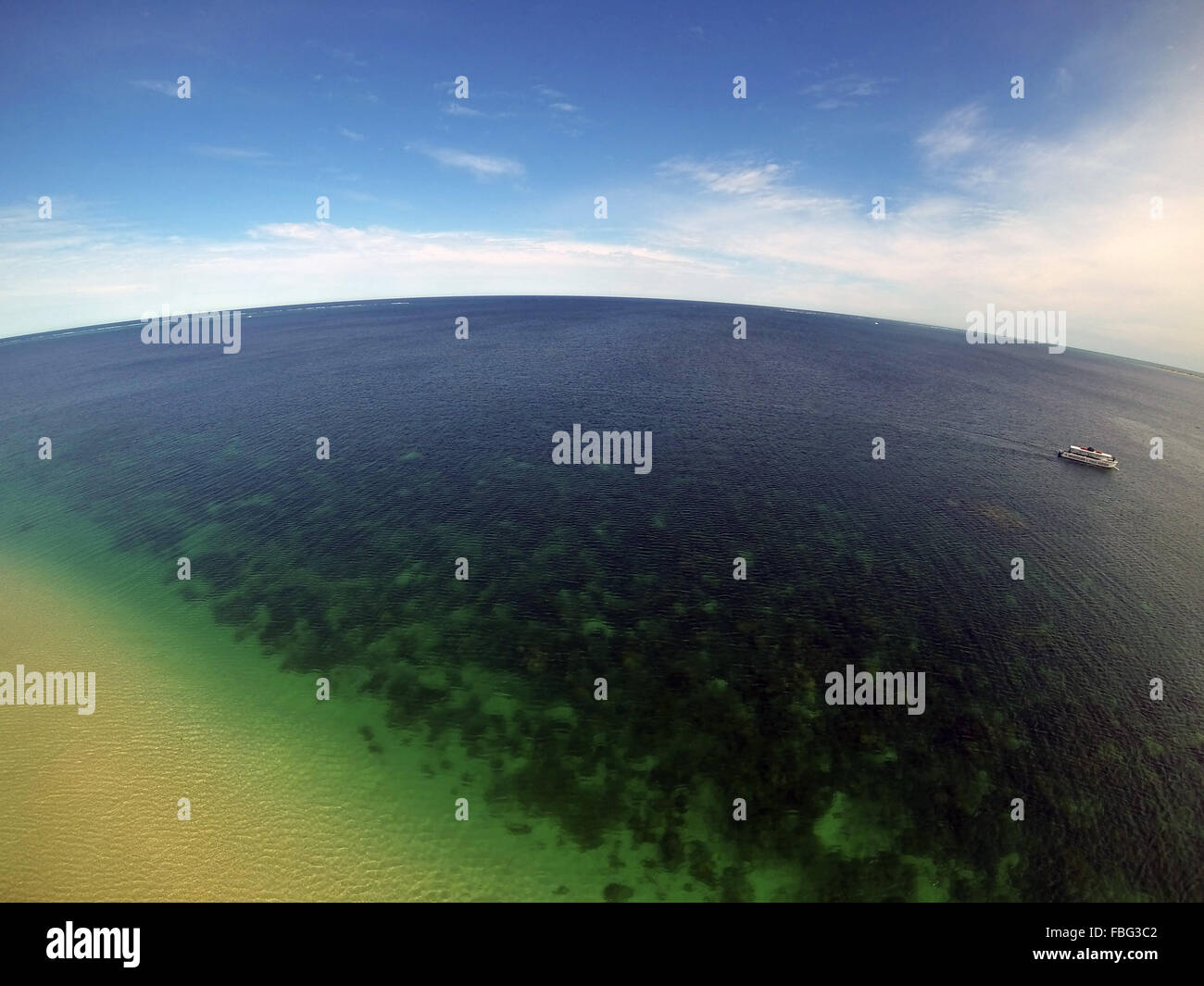 Aerial view of corals and boat in Coral Bay, Ningaloo Reef Marine Park ...