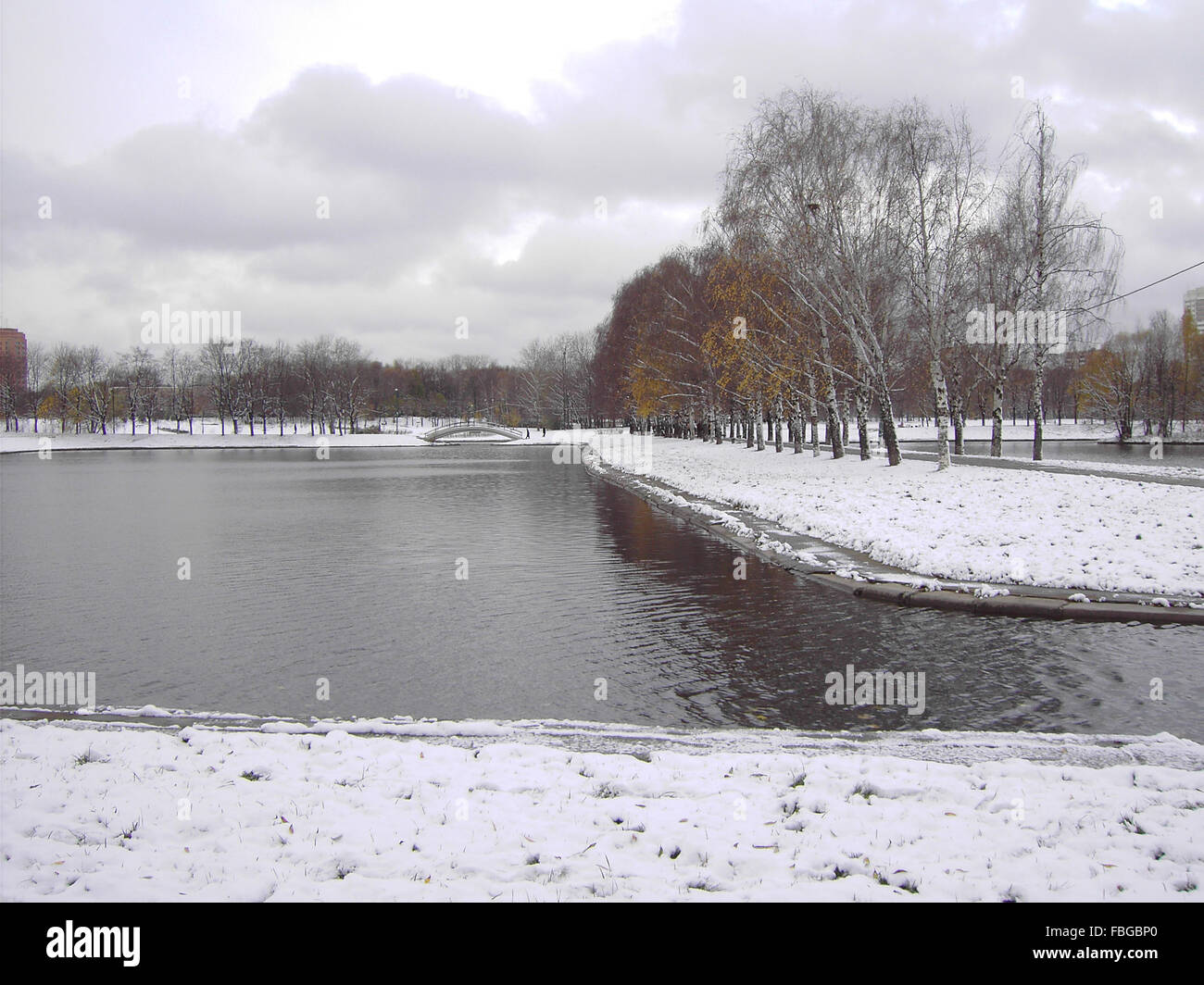 early melting snow, november, city park Stock Photo - Alamy