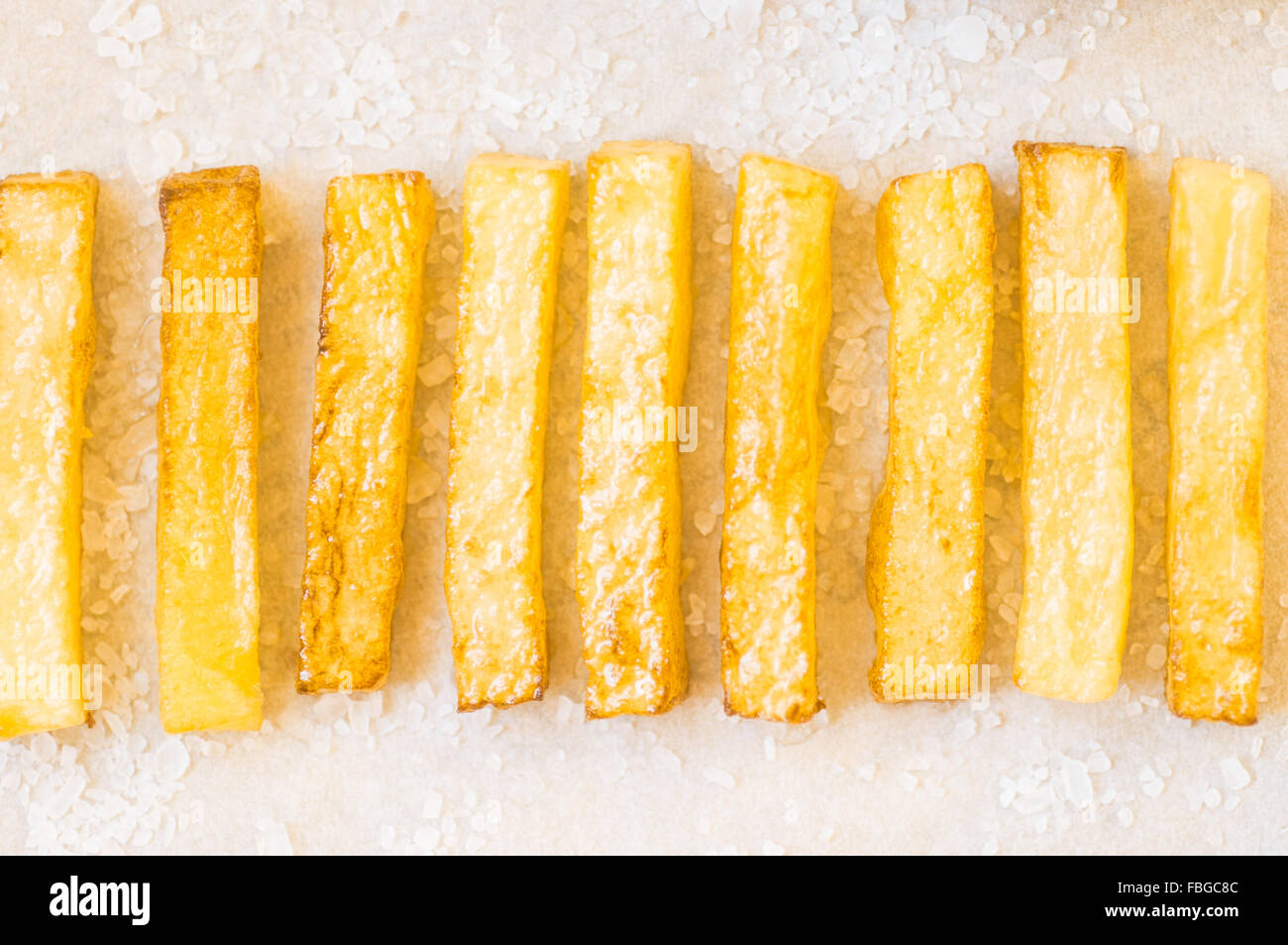 On salt French fries strips closeup Stock Photo - Alamy