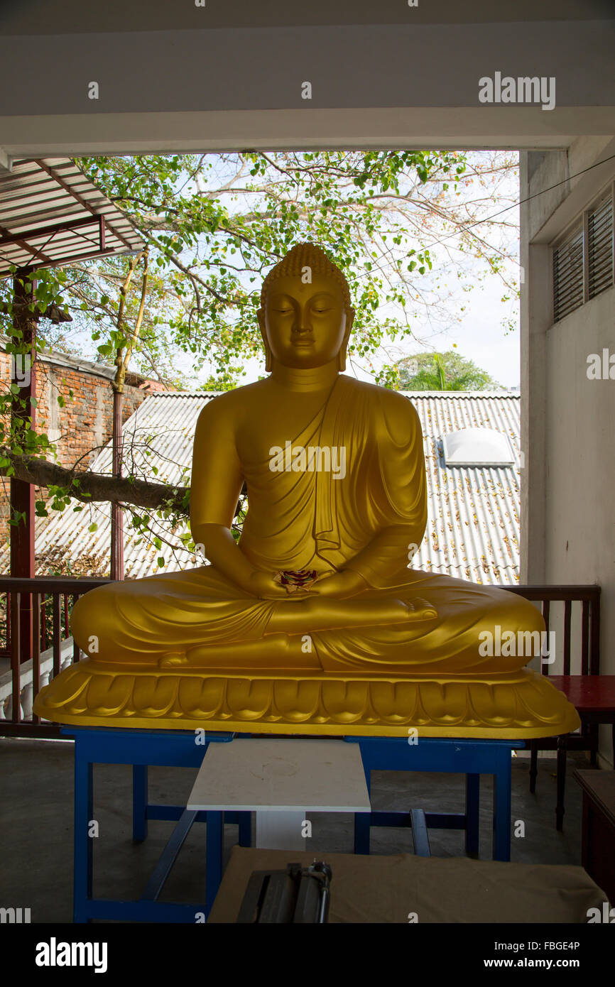 Large golden Buddha statue, Gangaramaya Buddhist Temple, Colombo, Sri ...