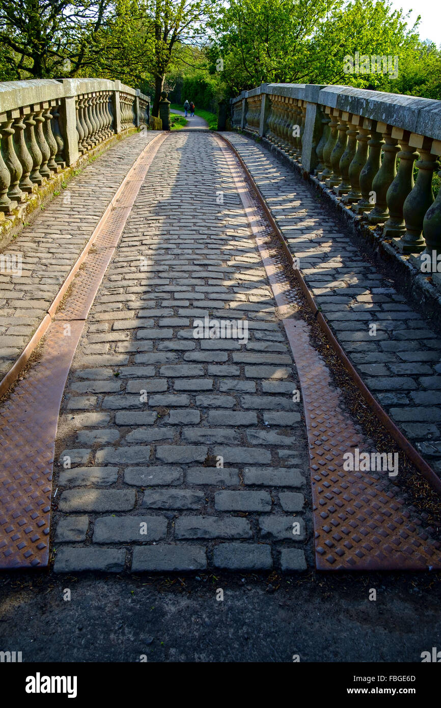 cobbled bridge path metal cart track pollock uk Stock Photo - Alamy
