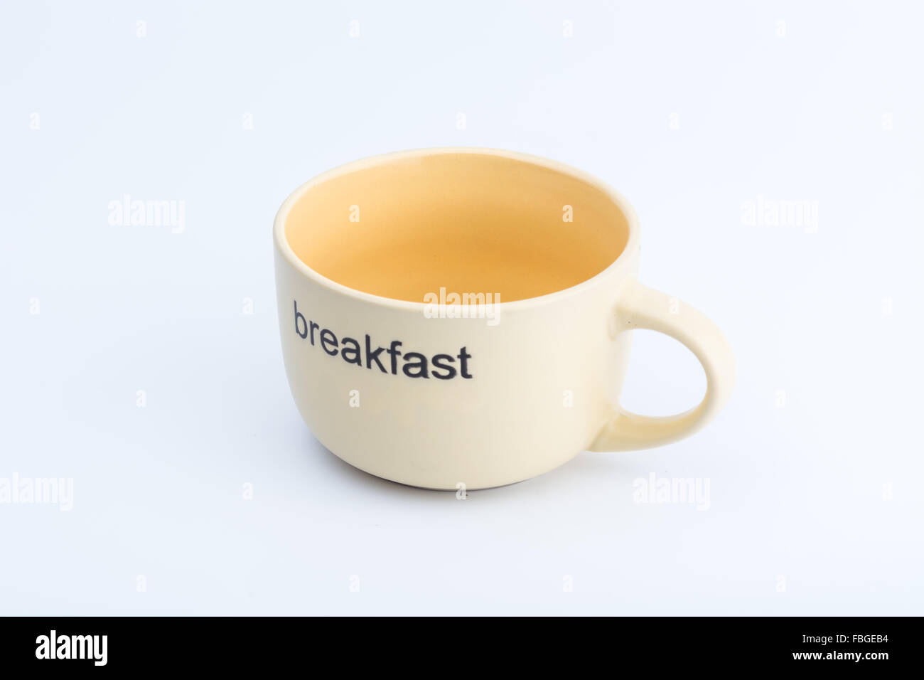 Cup beige color on white background Stock Photo - Alamy