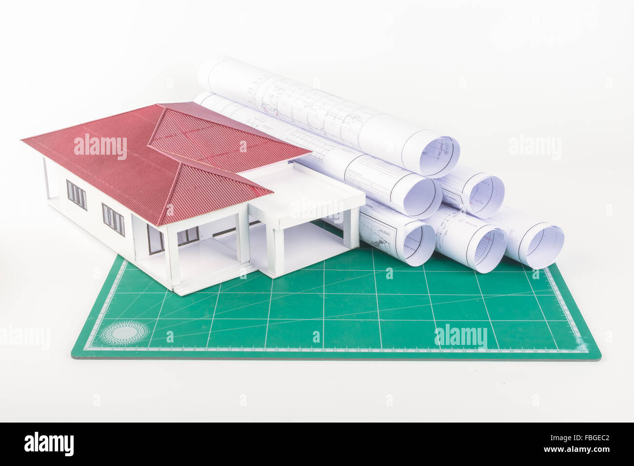Model of the house and scroll on white background Stock Photo - Alamy