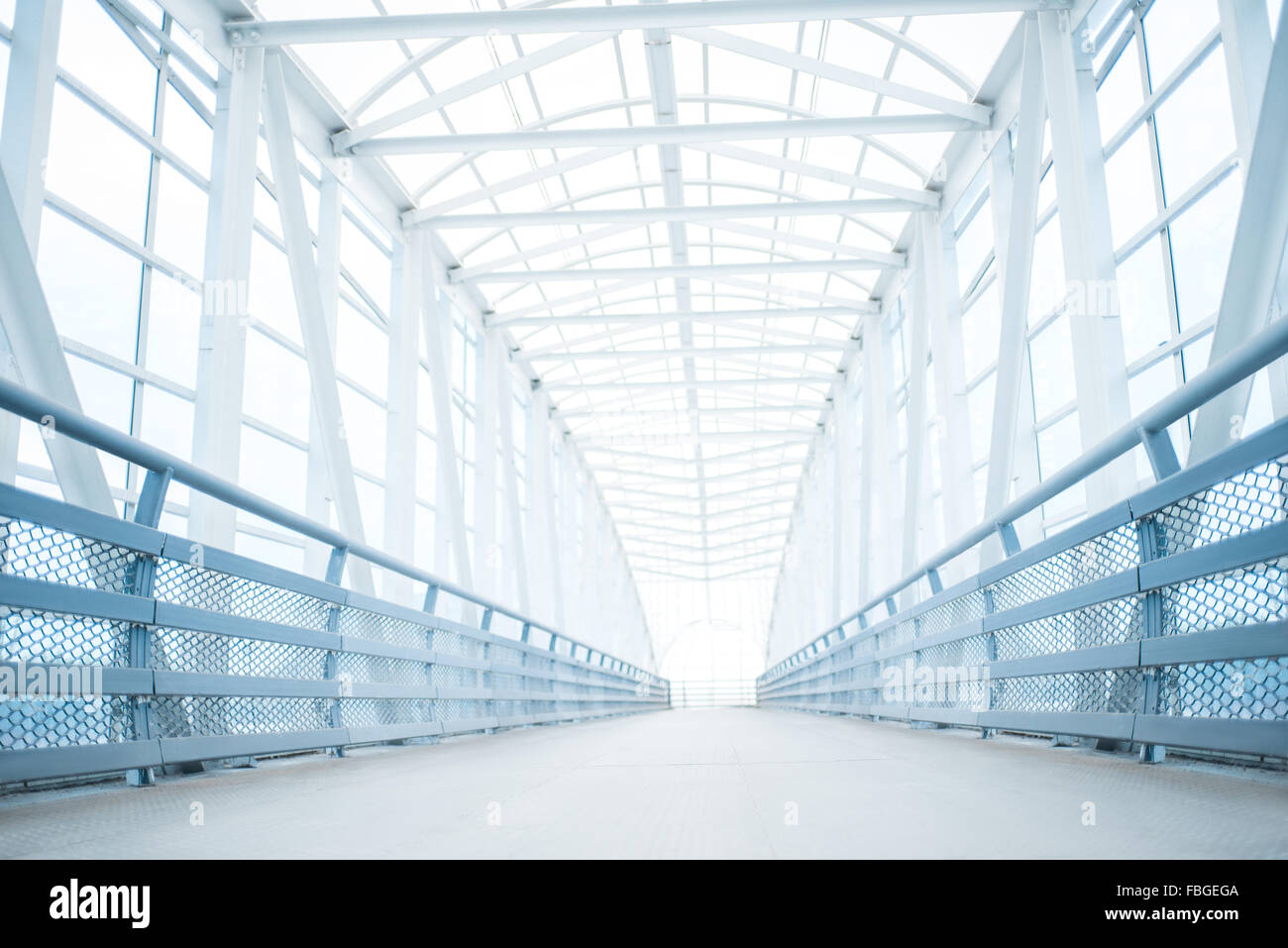 Peaceful empty road on the bridge against blue sky background of a city ...