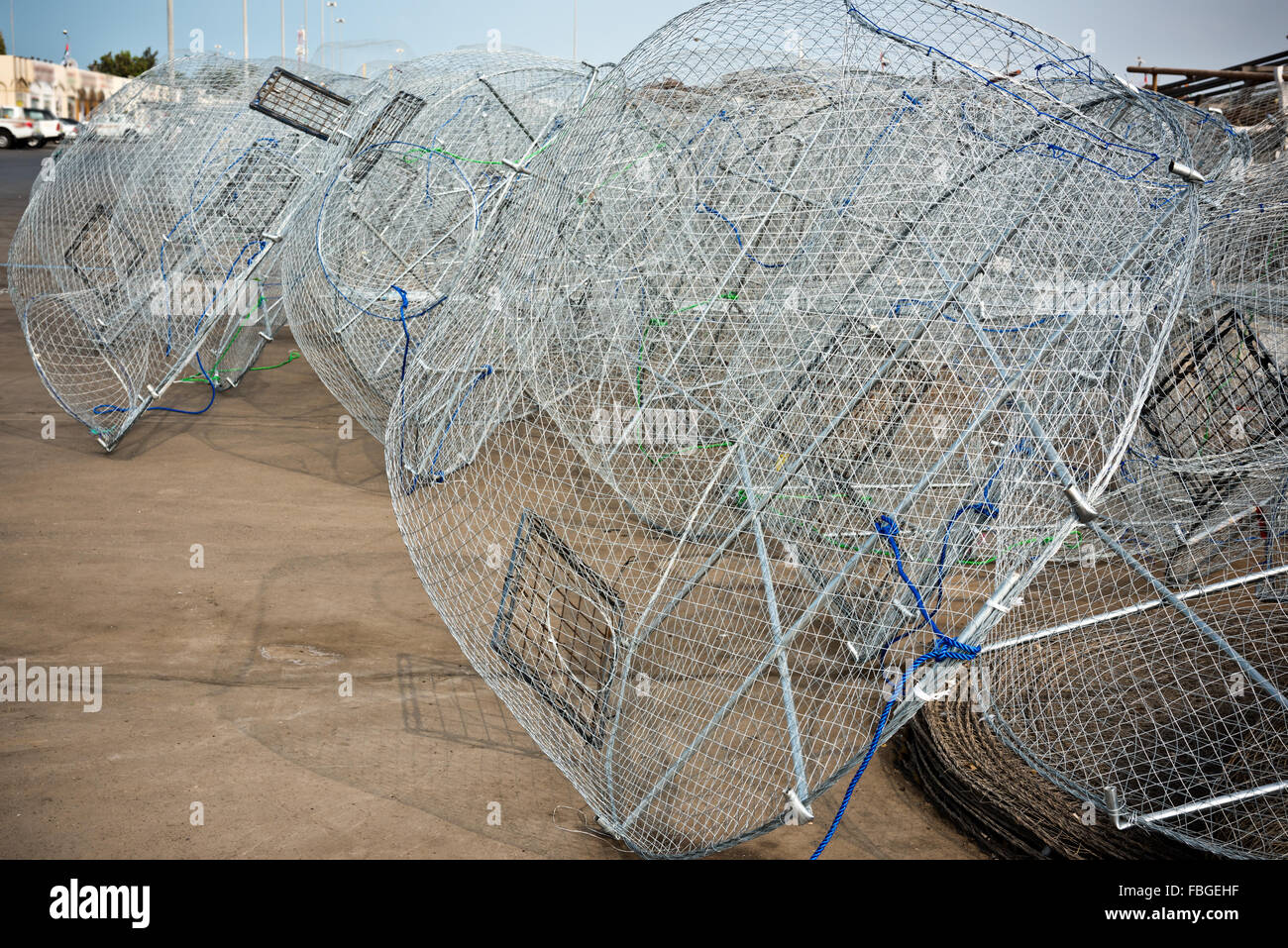 Metal fishing nets in a port. Horizontal shot Stock Photo - Alamy
