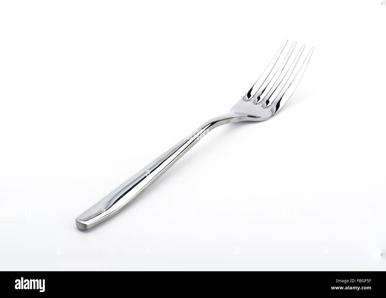 Shiny silver fork on white background Stock Photo - Alamy
