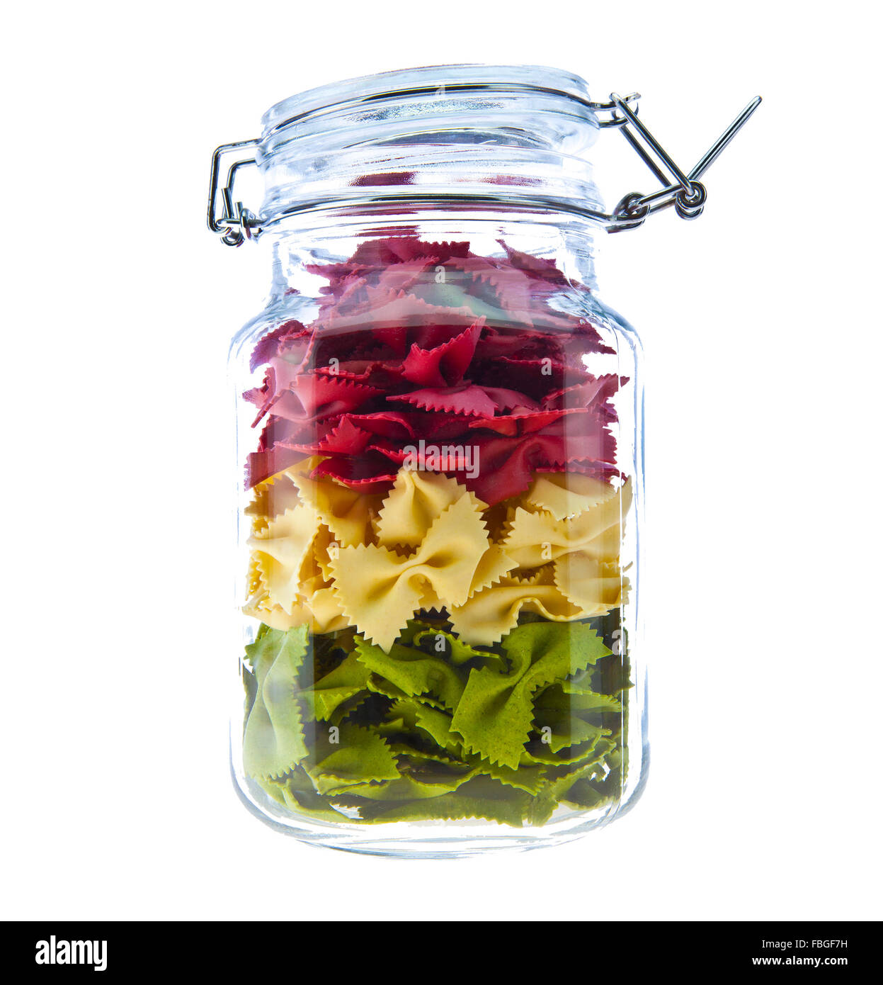 Jar of coloured pasta isolated on white Stock Photo - Alamy