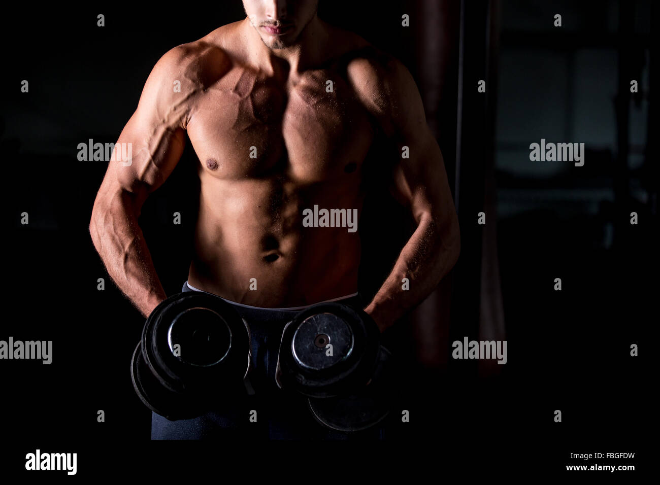 Young attractive caucasian bodybuilder sportsman working out with ...