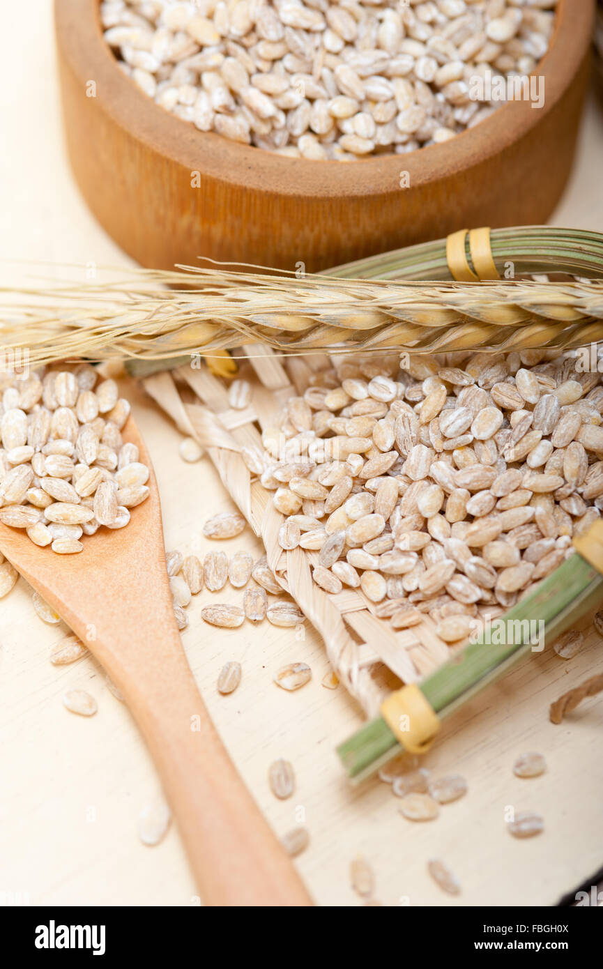 organic barley grains over rustic wood table macro closeup Stock Photo ...
