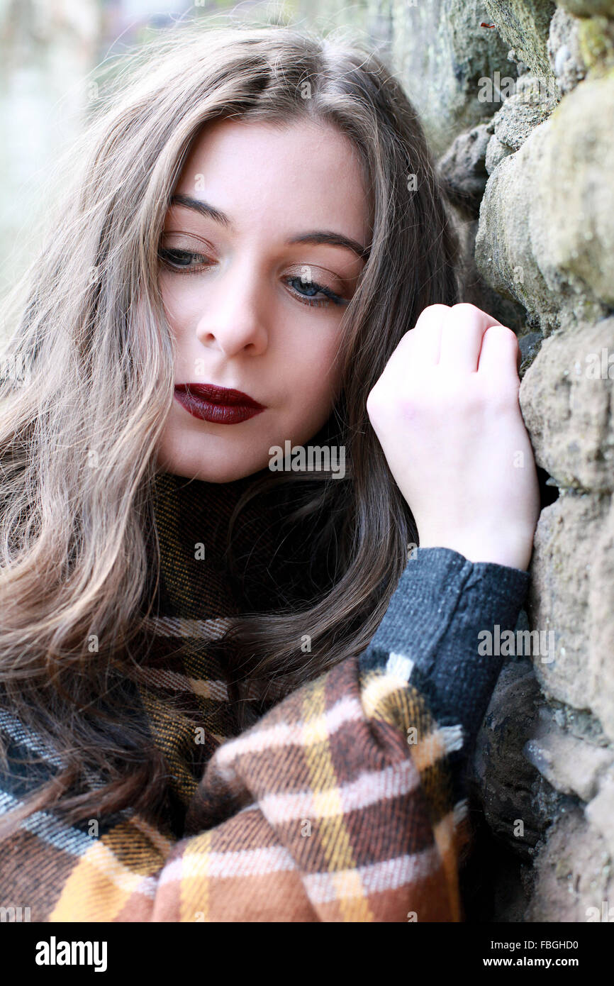 Female leaning against wall hi-res stock photography and images - Alamy