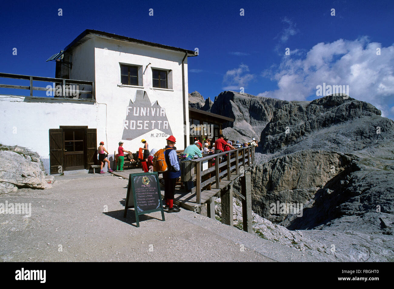 Hikers at Rosetta cable car station, plateau of Pale di San Martino ...