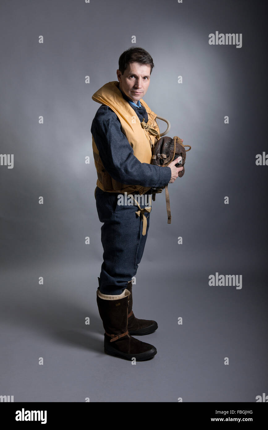 Side view portrait, of a World War Two RAF pilot/aircrew member holding ...