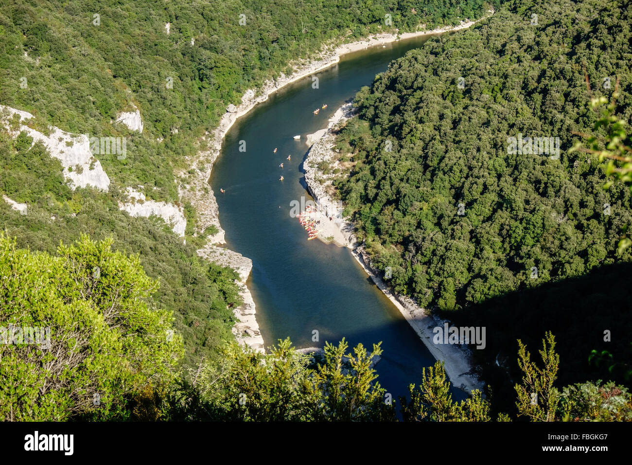 The Ardeche river with canoists in the gorges of the Ardeche, France ...