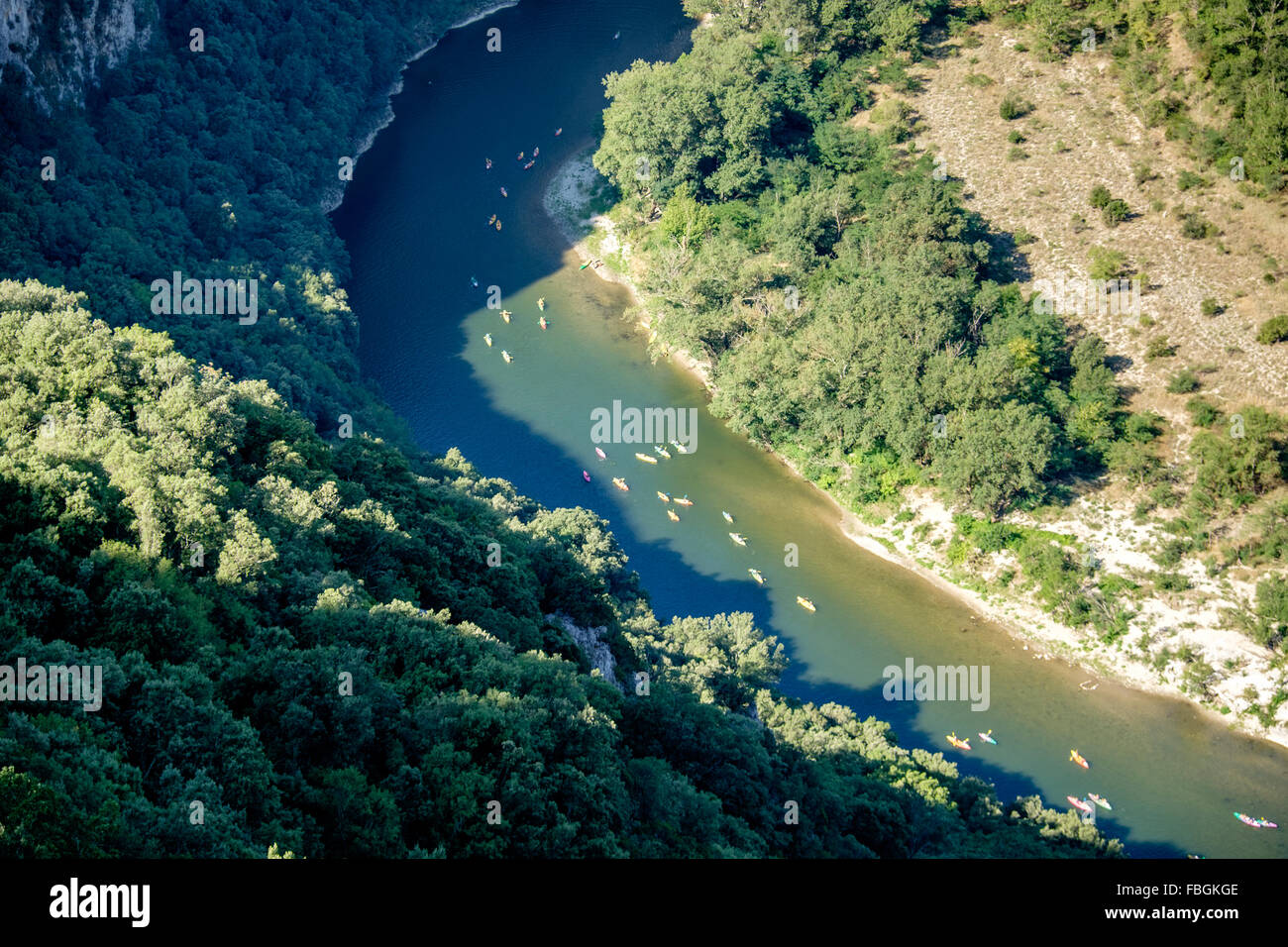 The Ardeche river with canoists in the gorges of the Ardeche, France ...