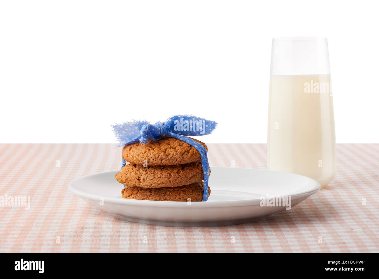 Stack of three homemade oatmeal cookies tied with blue ribbon in small ...