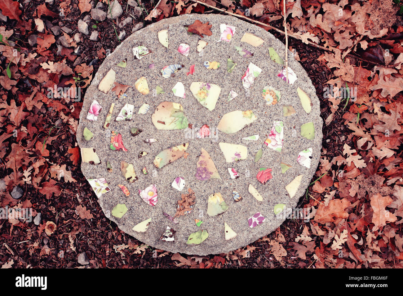 Hand made concrete mandala with pieces of broken porcelain Stock Photo ...