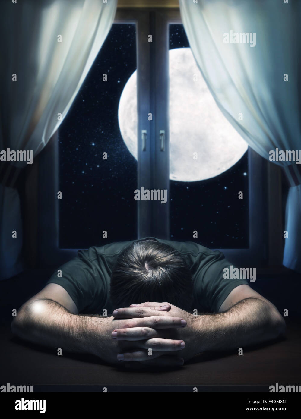 Man sleeping on the table Stock Photo - Alamy