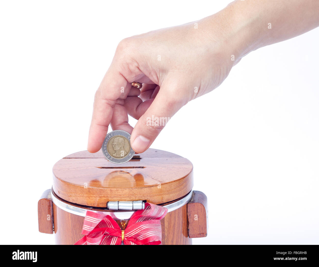 Putting coin to save money, stock photo Stock Photo - Alamy