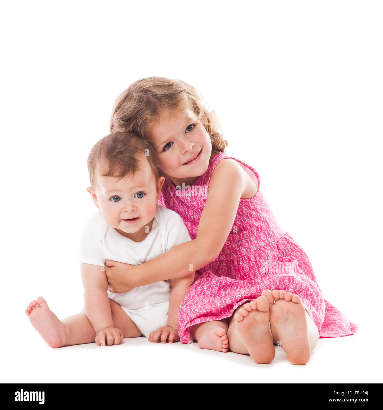 Two sisters isolated Stock Photo - Alamy
