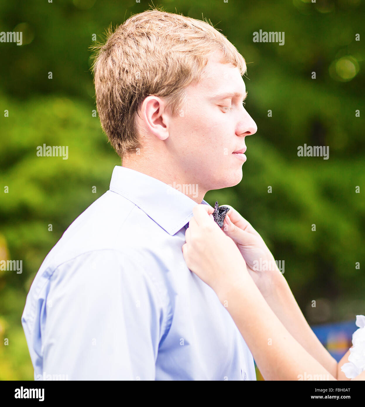 Fixing bow tie hi-res stock photography and images - Alamy