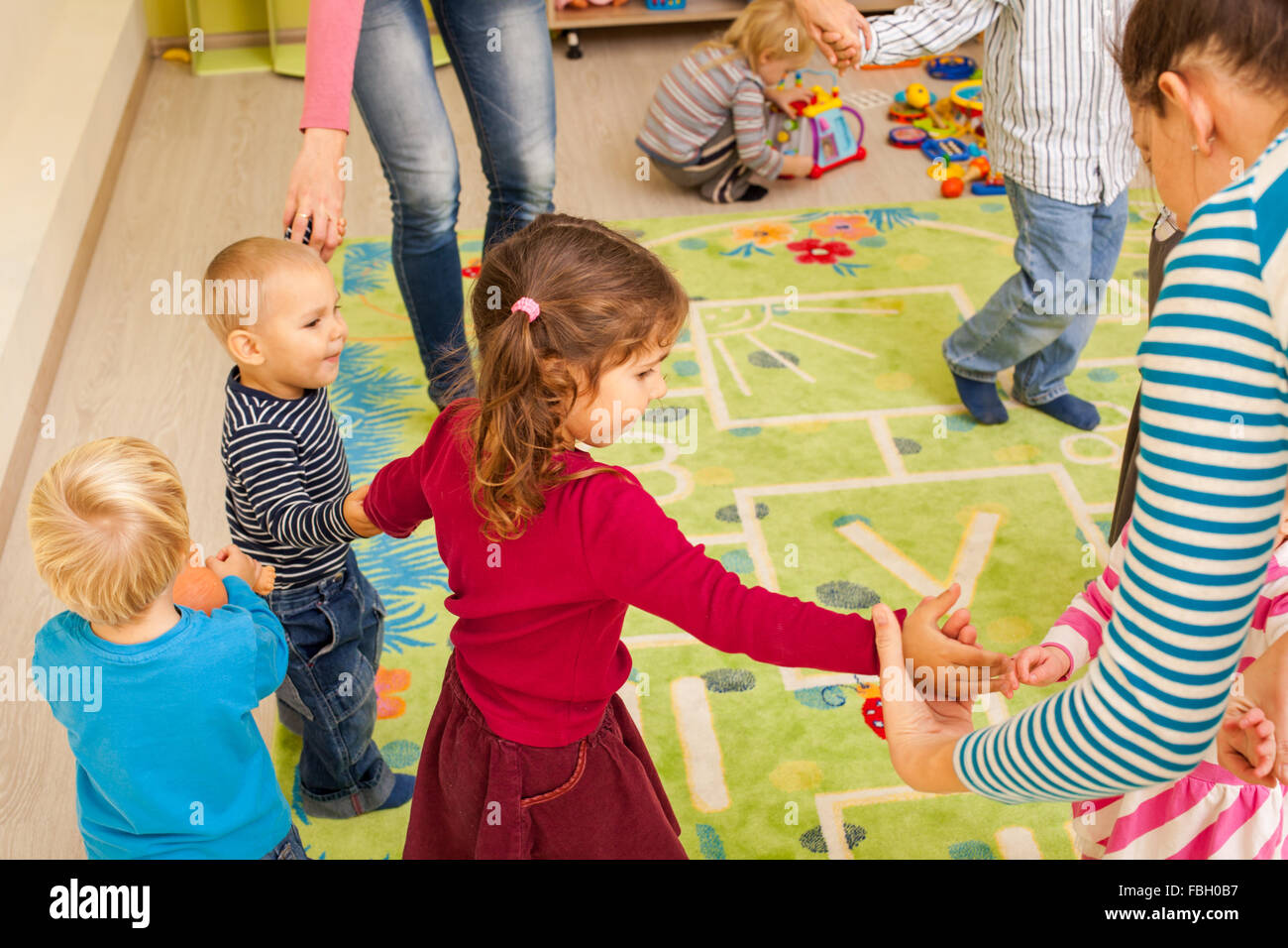 Group of little children dancing Stock Photo - Alamy