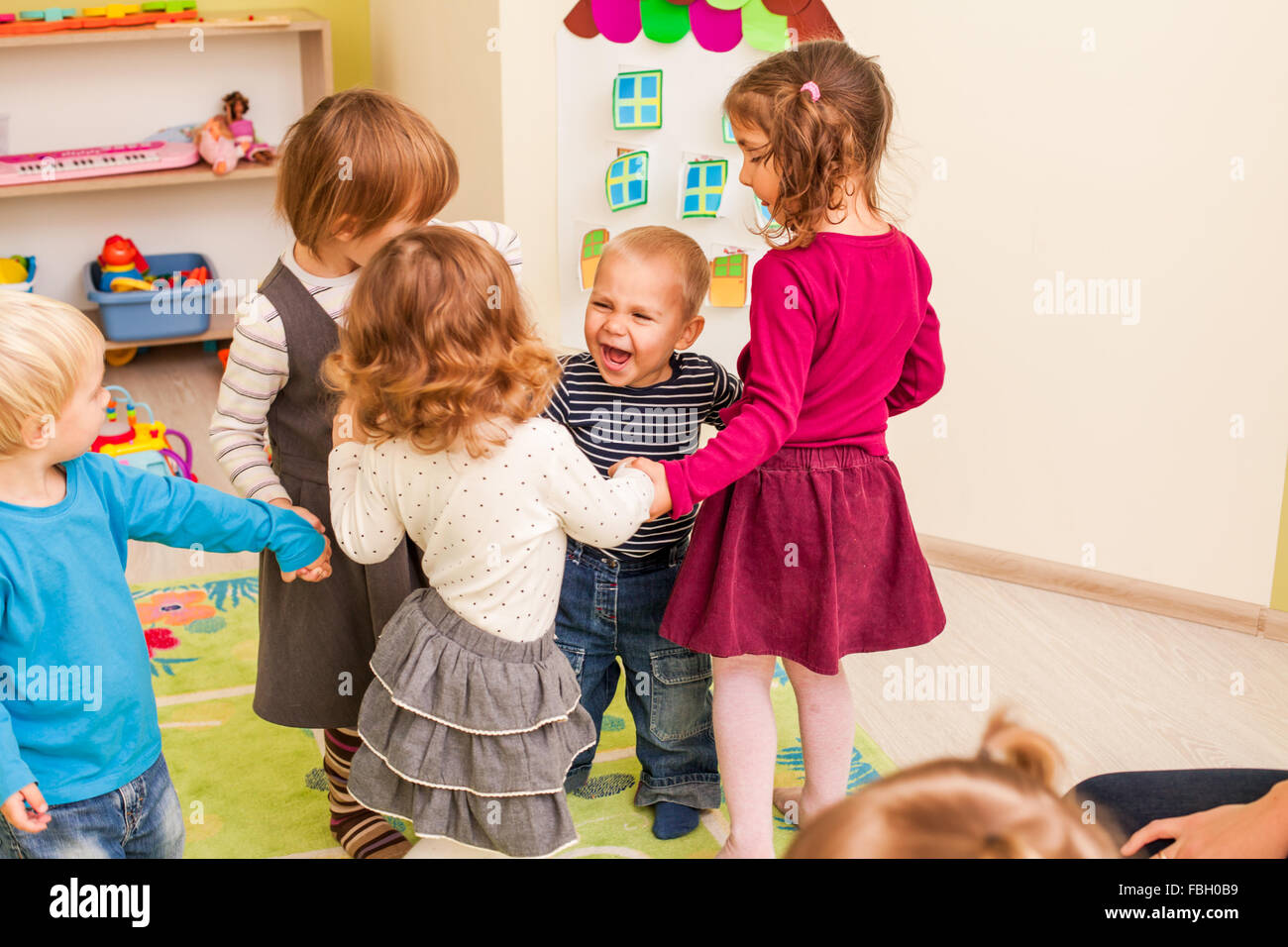 Group of little children dancing Stock Photo - Alamy