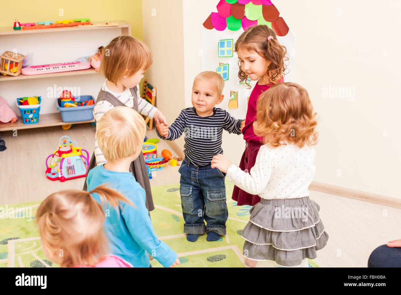 Group of little children dancing Stock Photo - Alamy