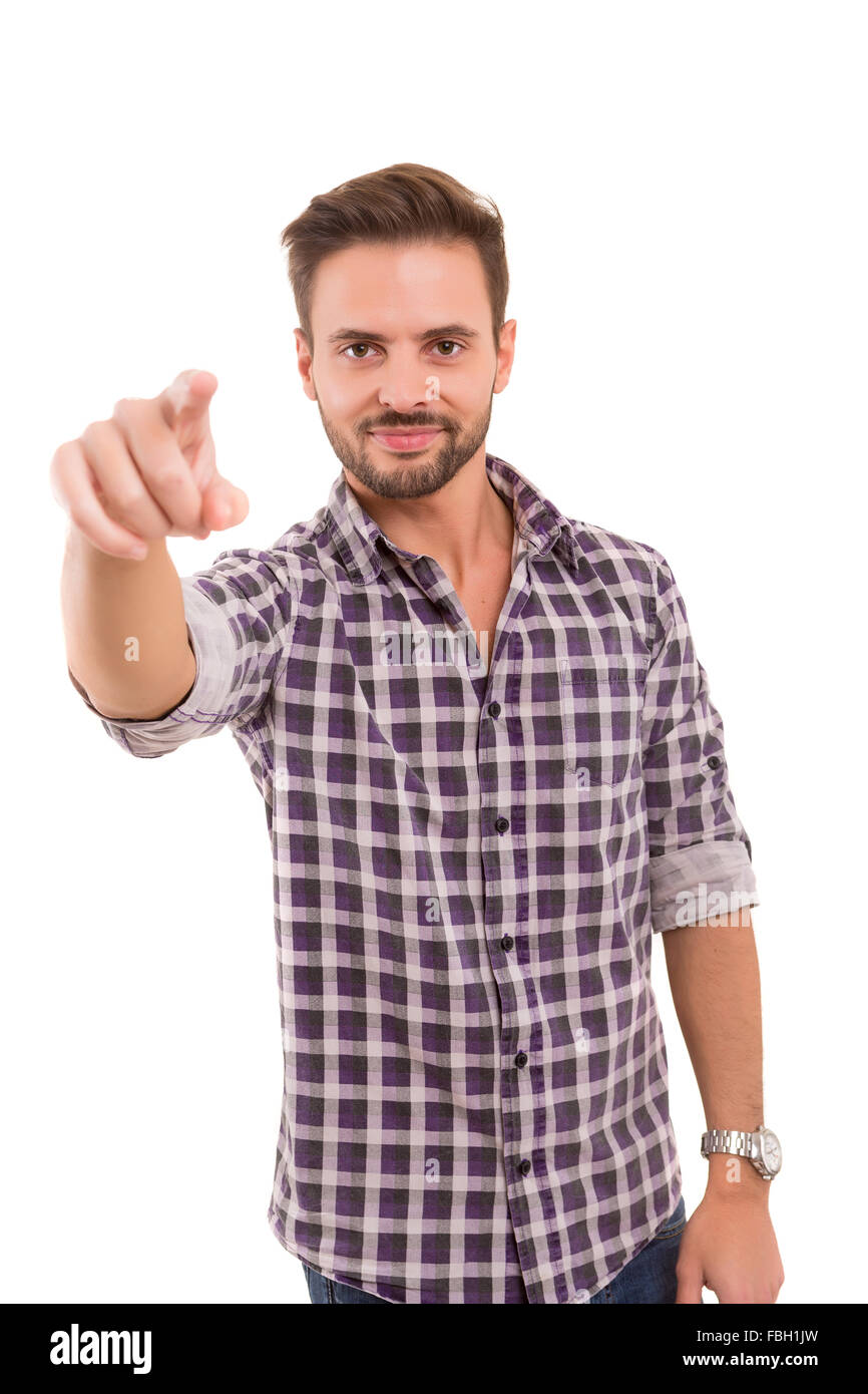 Handsome young man pointing at you, isolated over white background ...