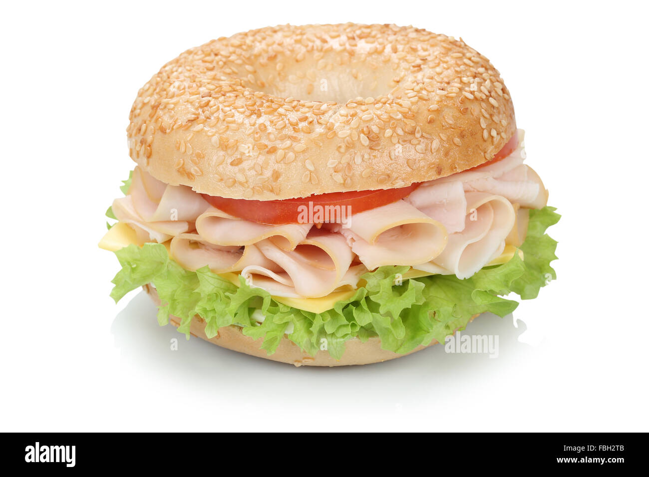 Bagel sandwich for breakfast with ham, cream cheese, tomatoes and ...