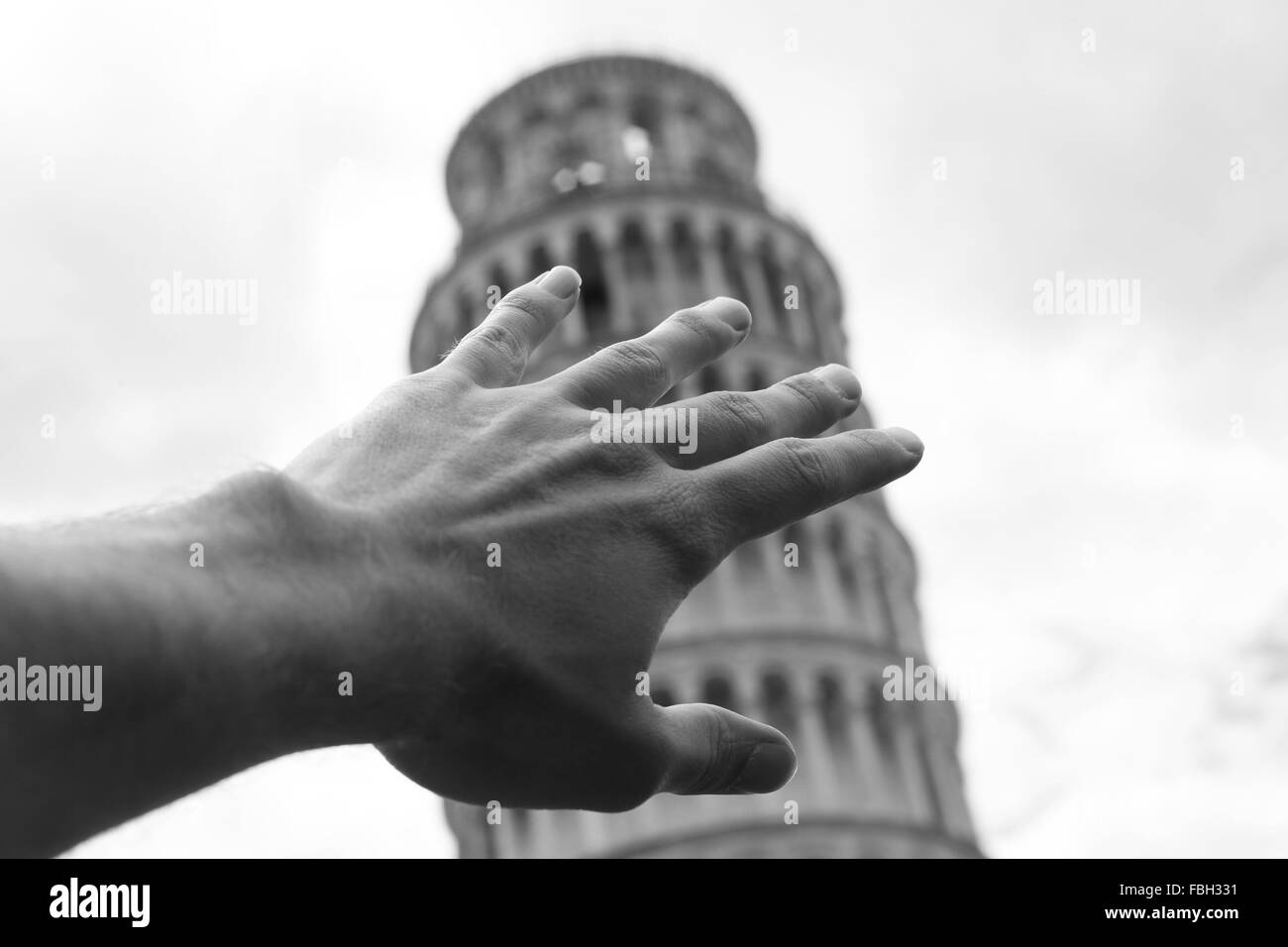 Tower of Pisa and male hand Stock Photo - Alamy